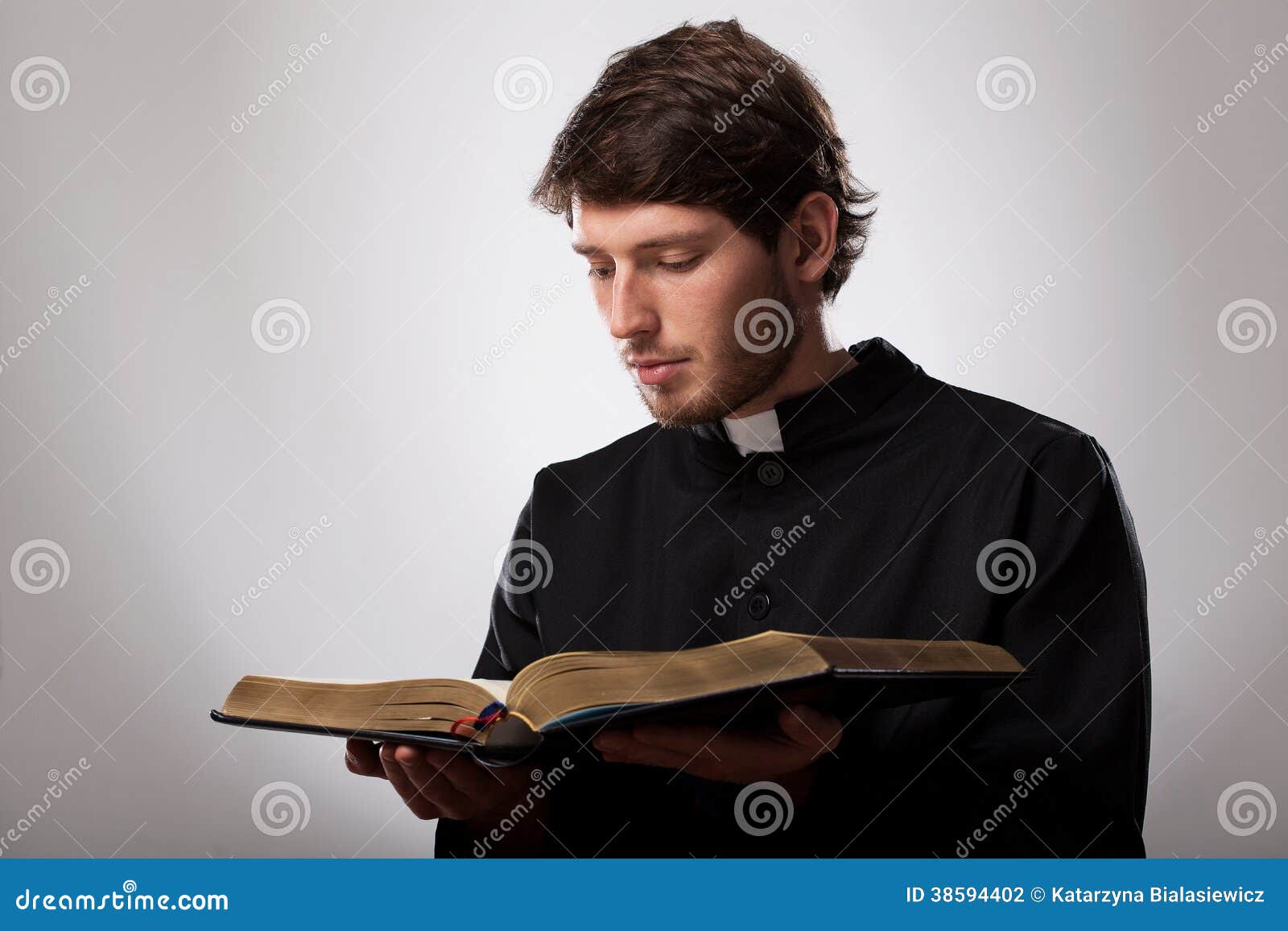 Priest with Holy Bible stock photo. Image of isolated - 38594402