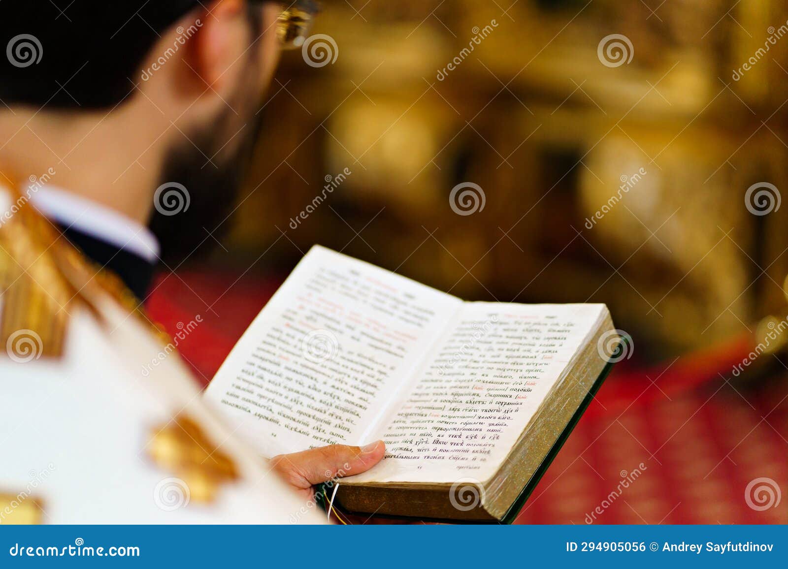 A Priest with a Prayer Book in the Church for the Service. Editorial ...