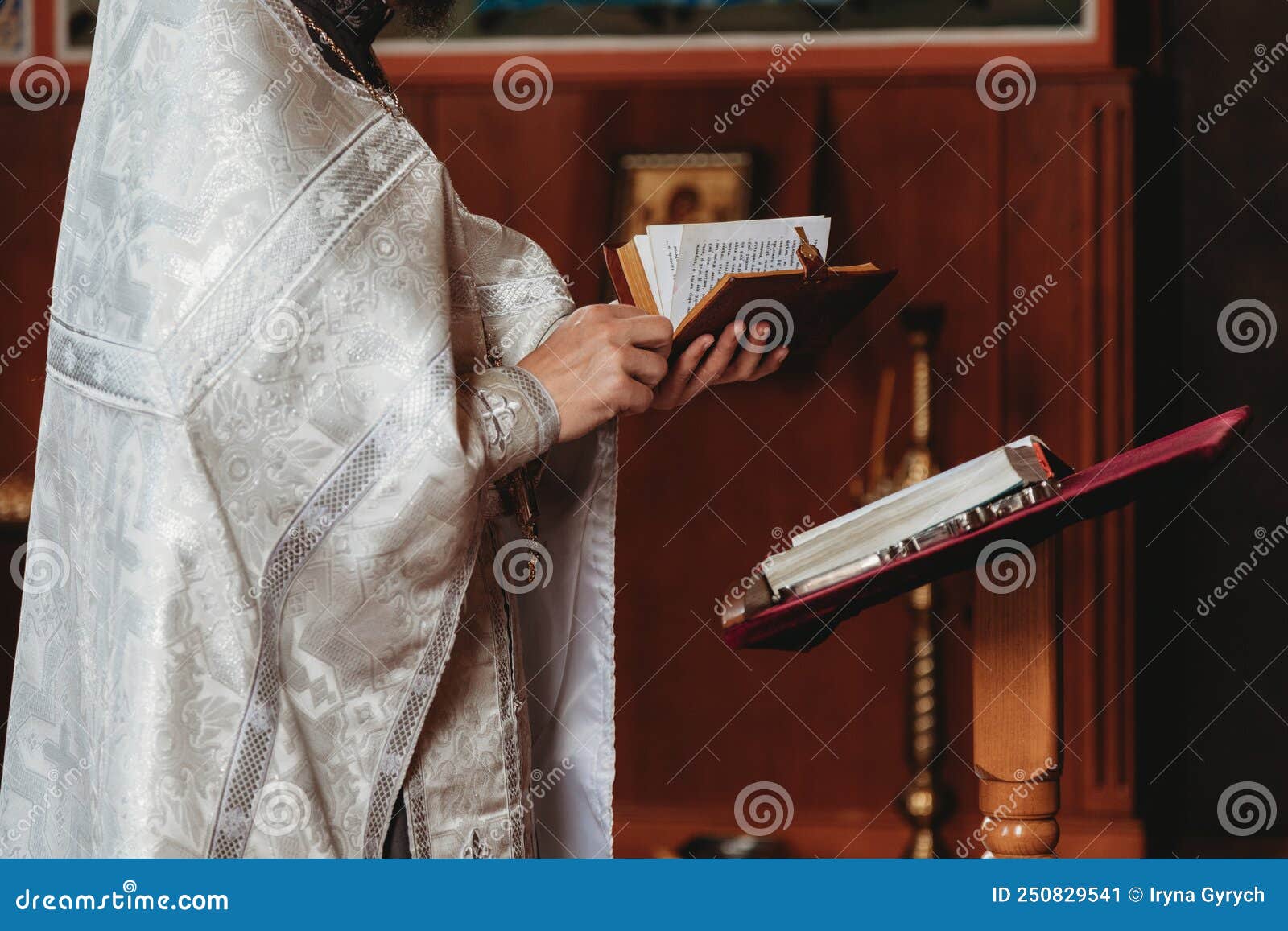 Priest reading from bible stock image. Image of gospel - 250829541