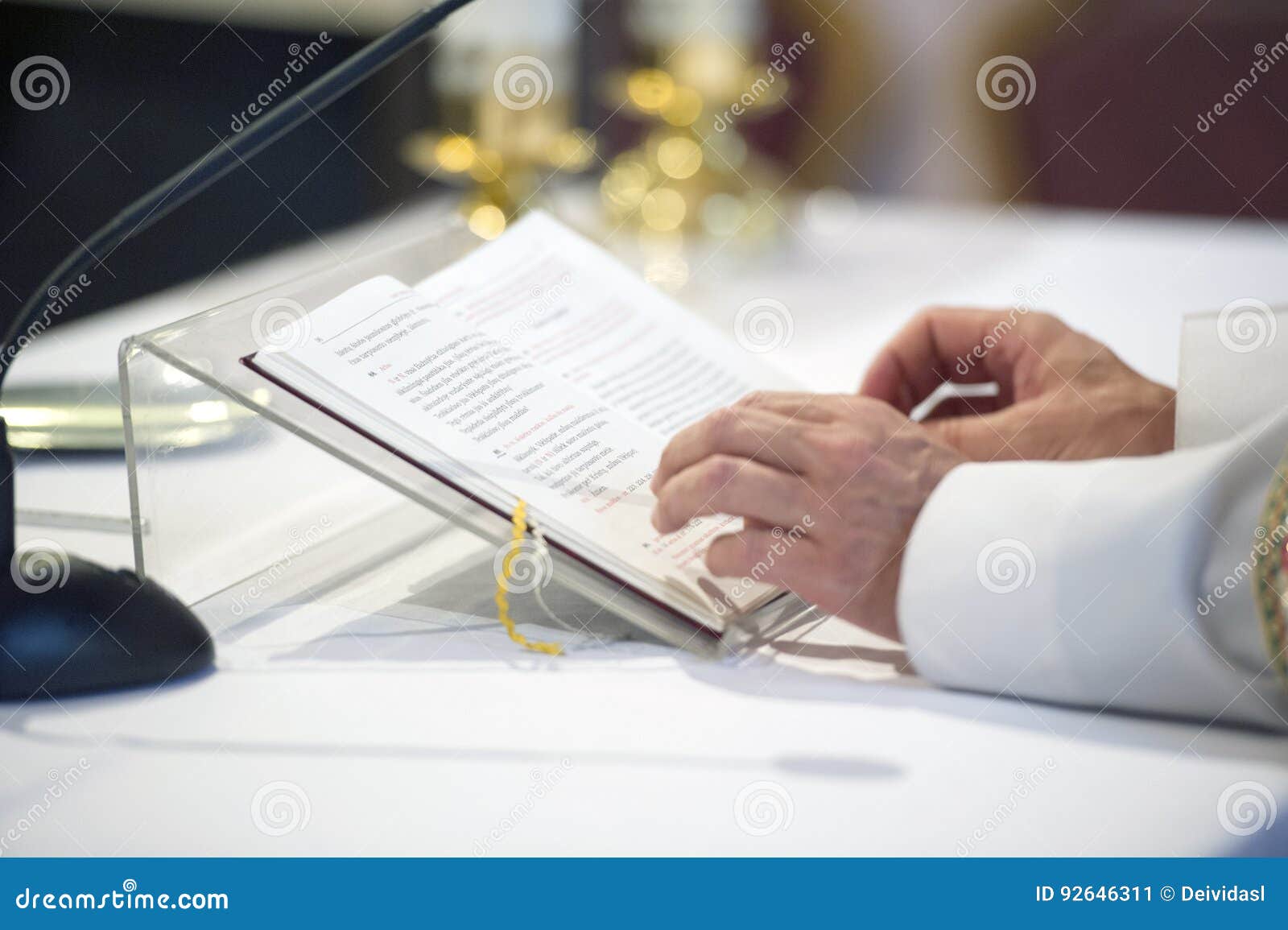 Priest reading a bible stock image. Image of bands, cross - 92646311