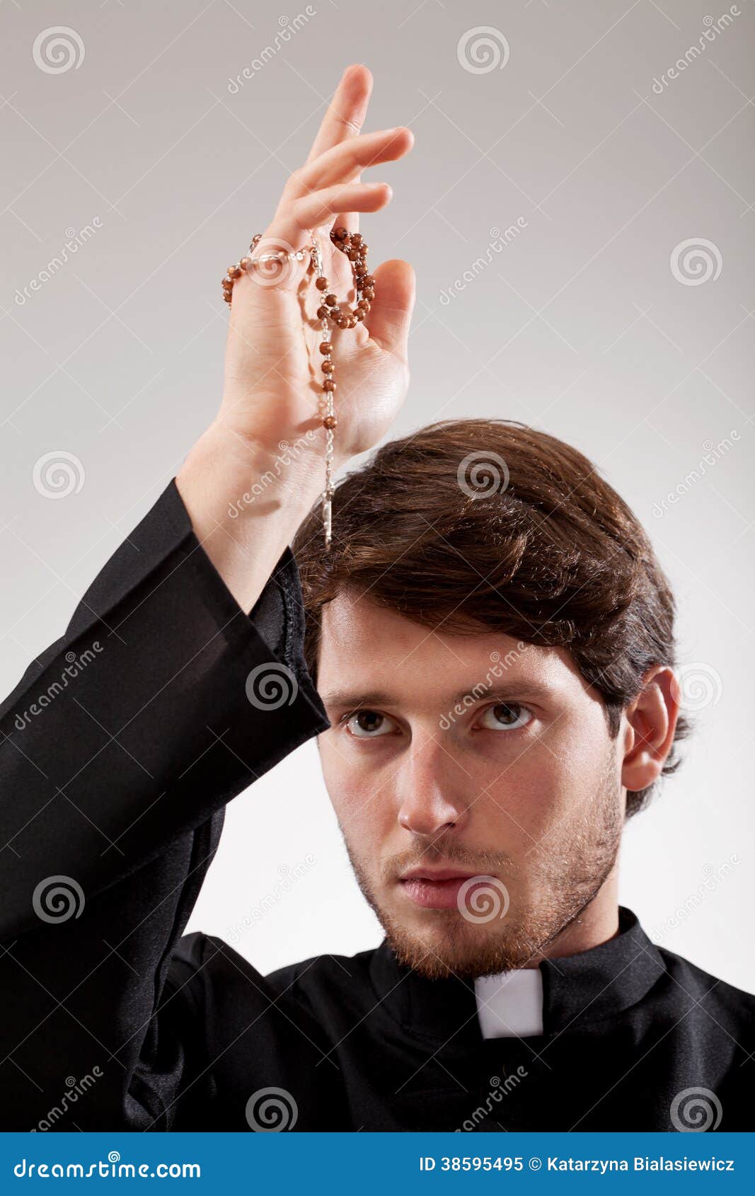 Priest with rosary stock image. Image of catholicism - 38595495