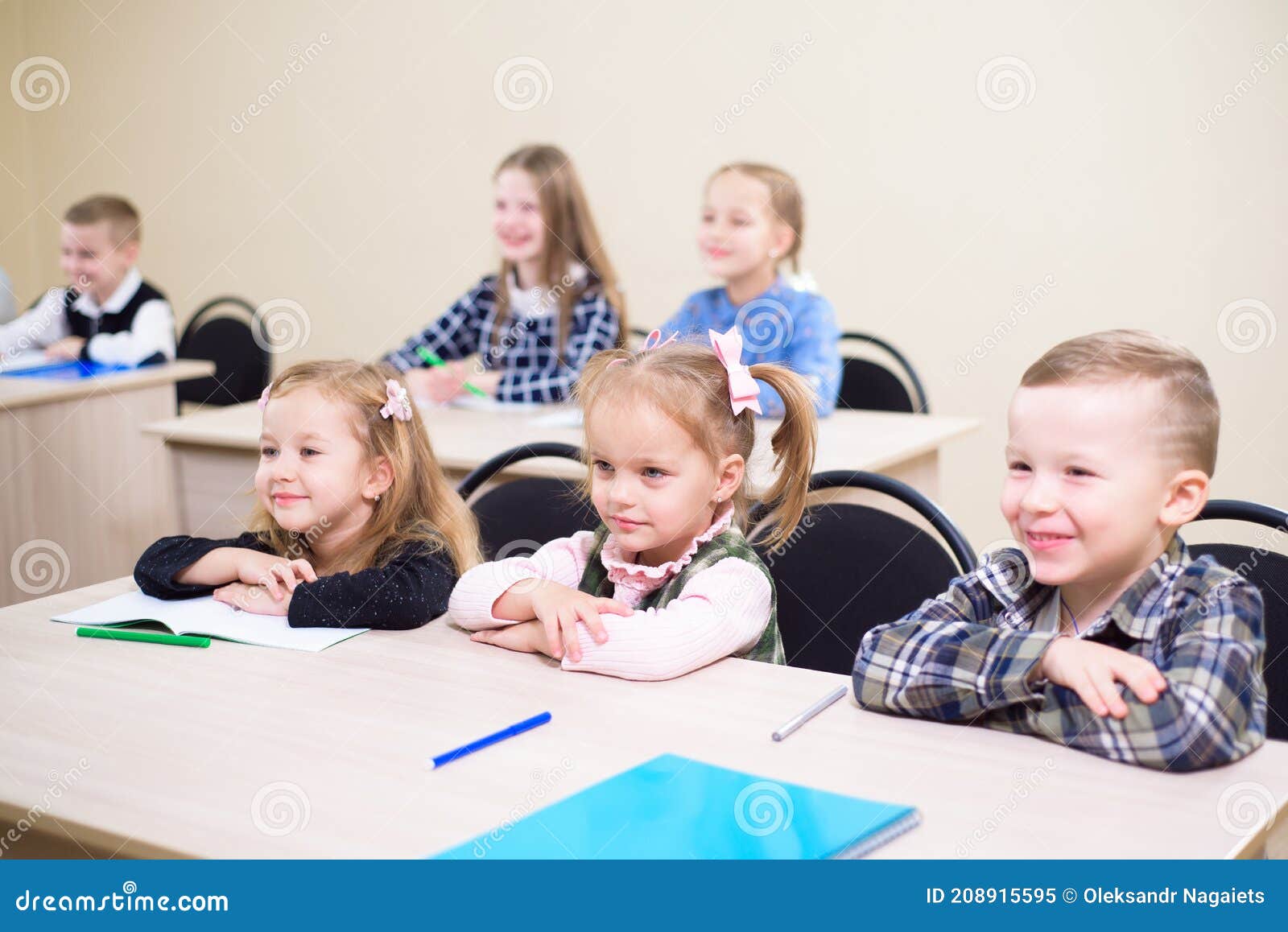 Primary School Children Work Together in Class. Stock Image - Image of ...