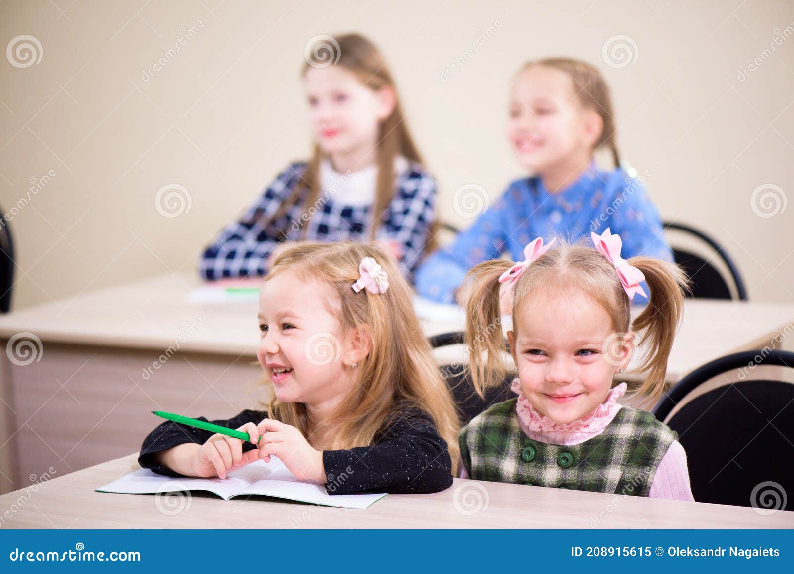 Primary School Children Work Together in Class. Stock Image - Image of ...