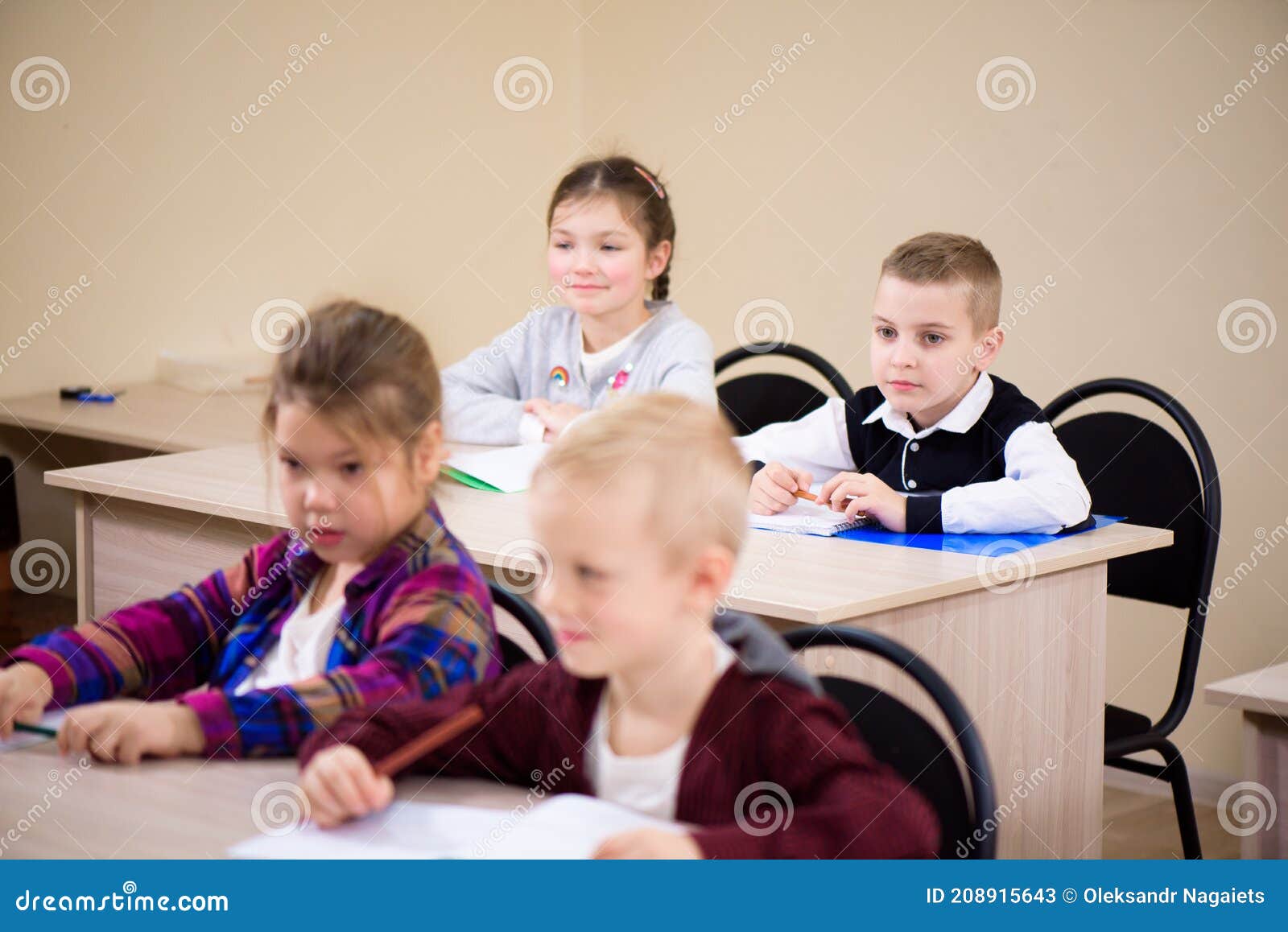 Primary School Children Work Together in Class. Stock Image - Image of ...