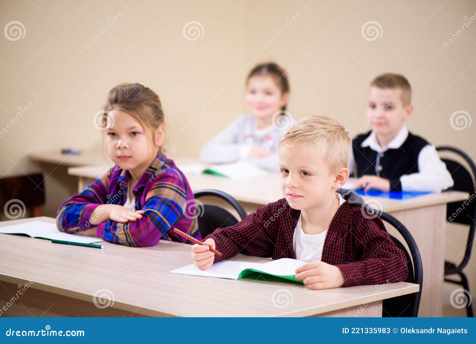 Primary School Children Work Together in Class. Stock Image - Image of ...