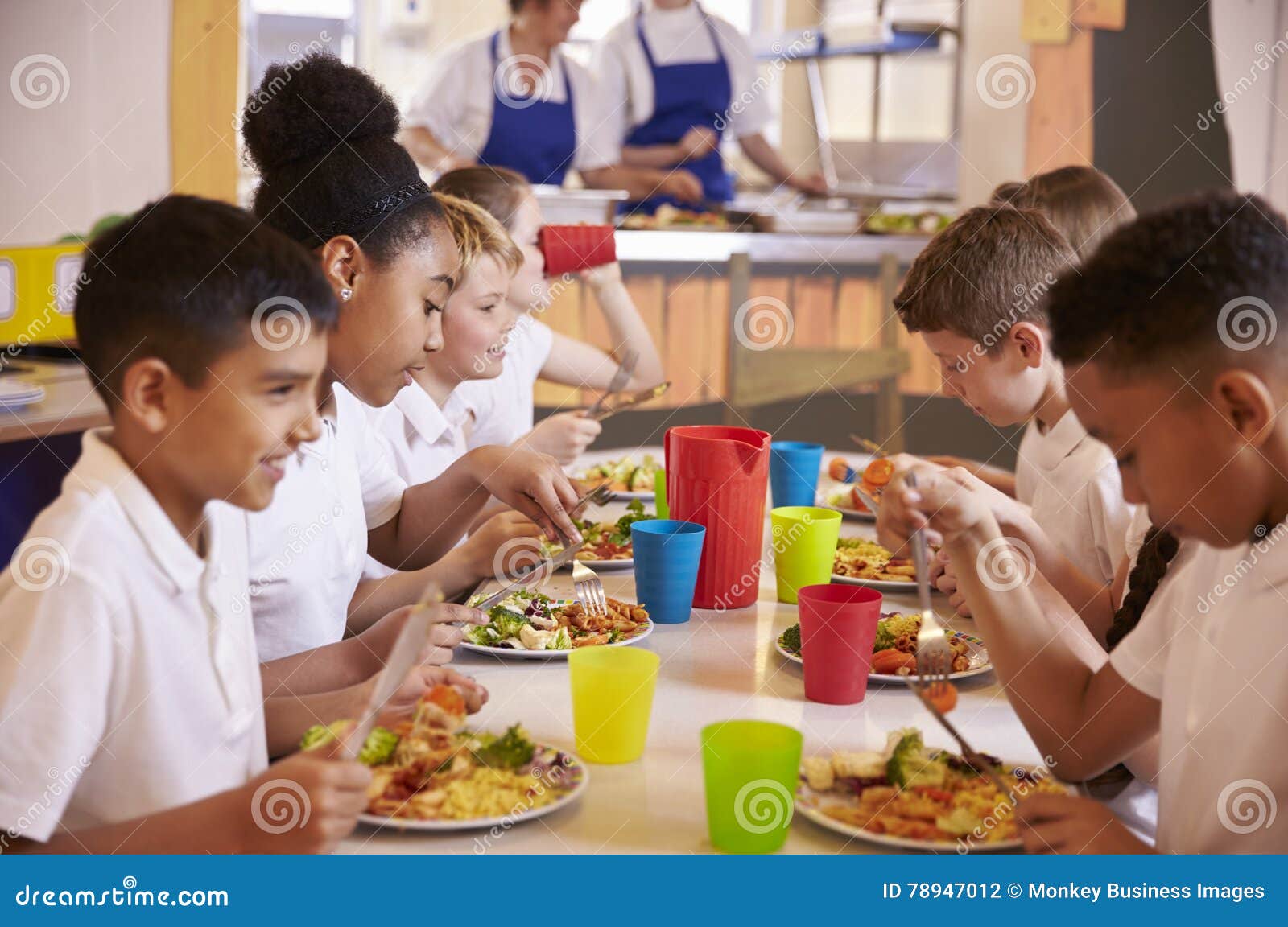 Primary School Kids Eating at a Table in School Cafeteria Stock Photo ...