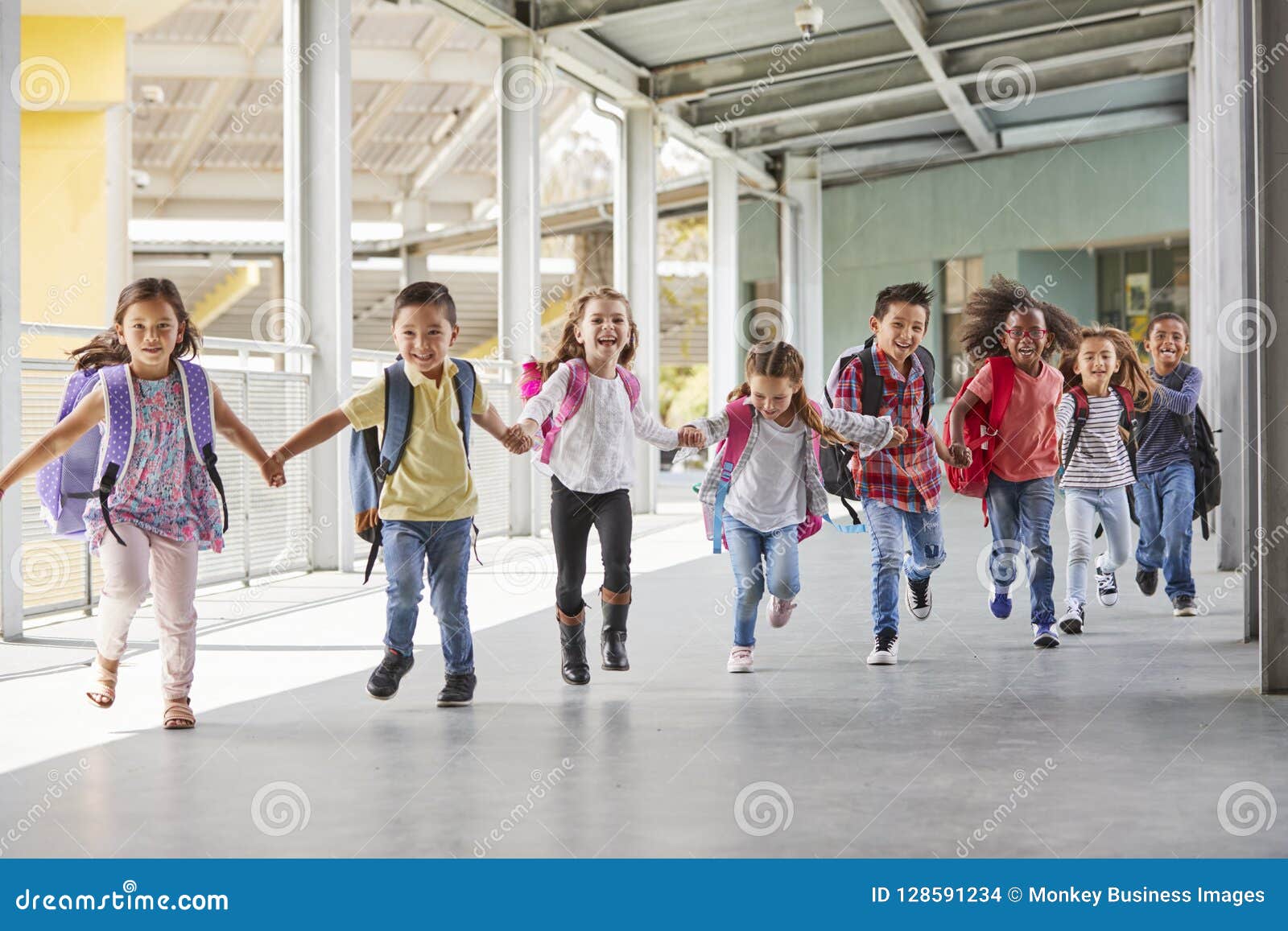 Primary School Kids Run Holding Hands in Corridor, Close Up Stock Photo ...
