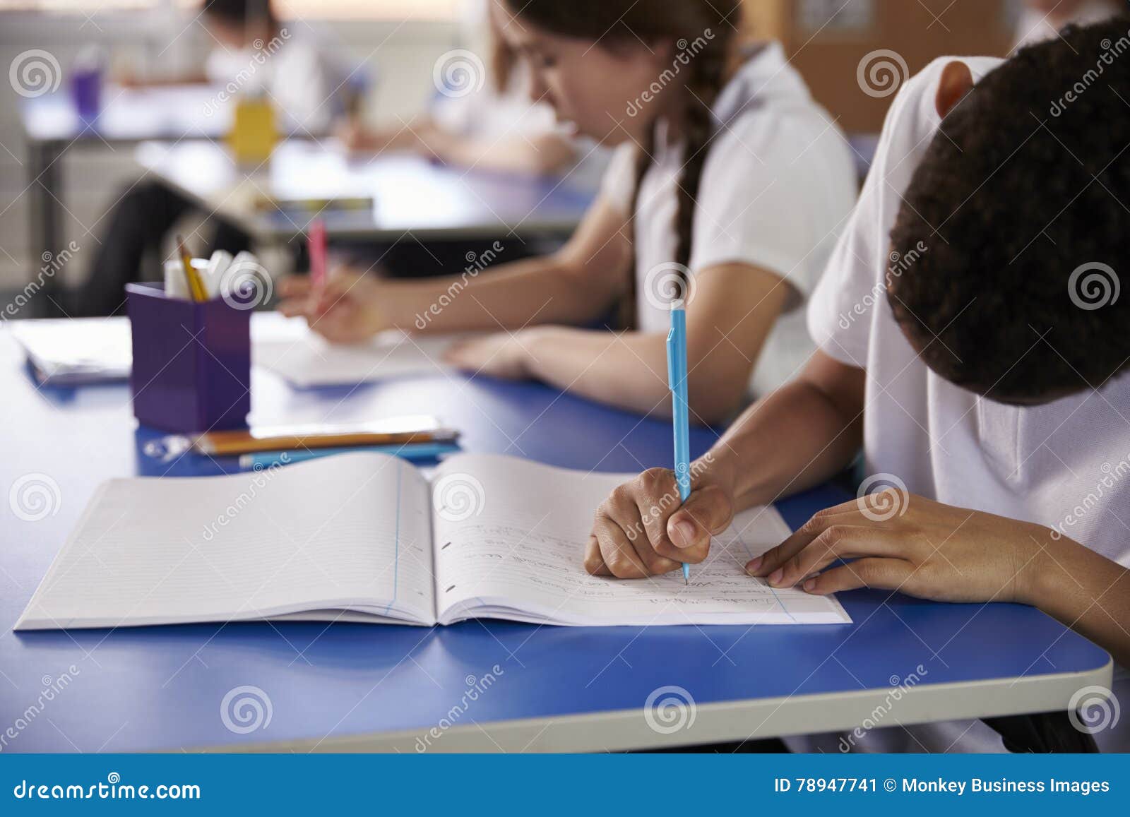 Primary School Kids Writing at Heir Desks, Close Up Stock Image - Image ...