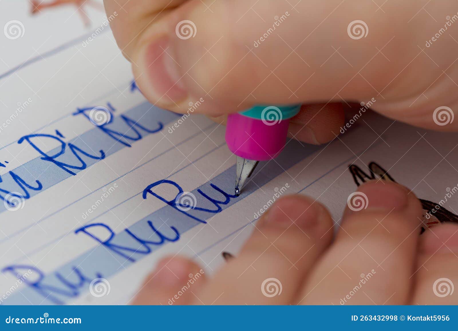 Primary School Pupil Learns To Write Stock Photo - Image of document ...