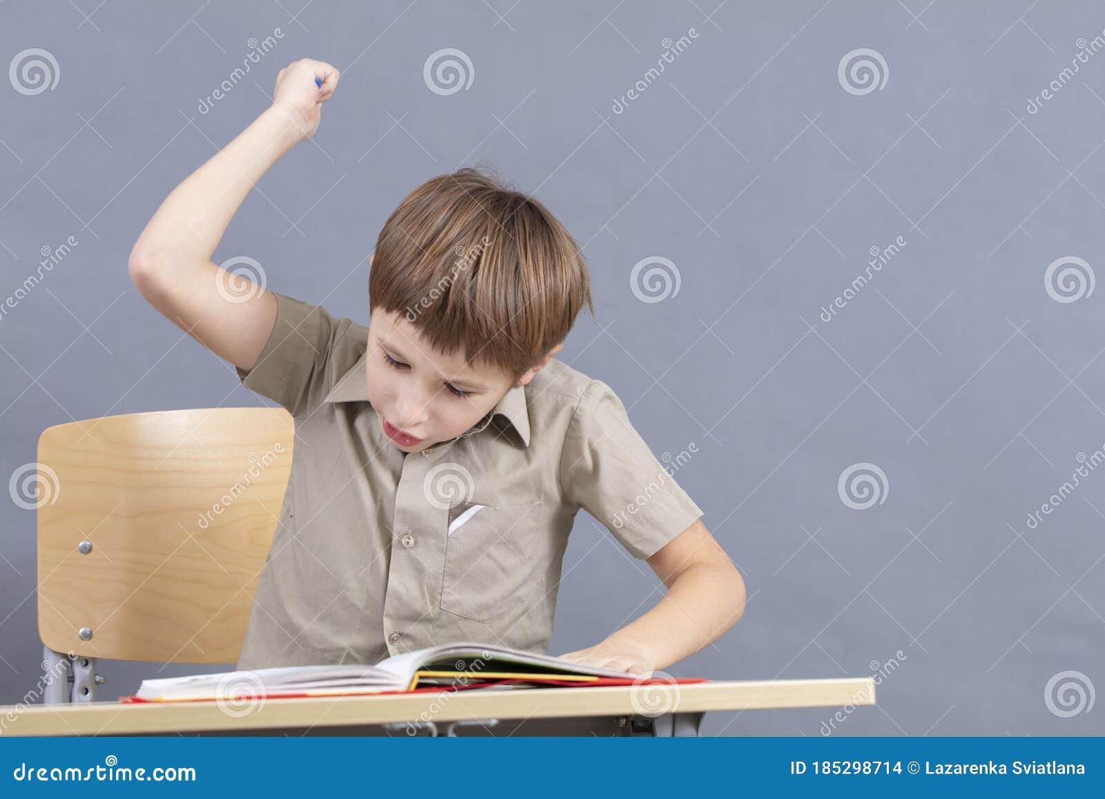 A Primary School Student is Doing Homework. Stock Photo - Image of ...