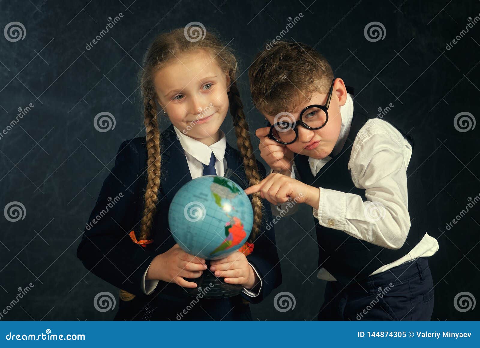 Elementary School Student with a Model of the Earth . Stock Image ...