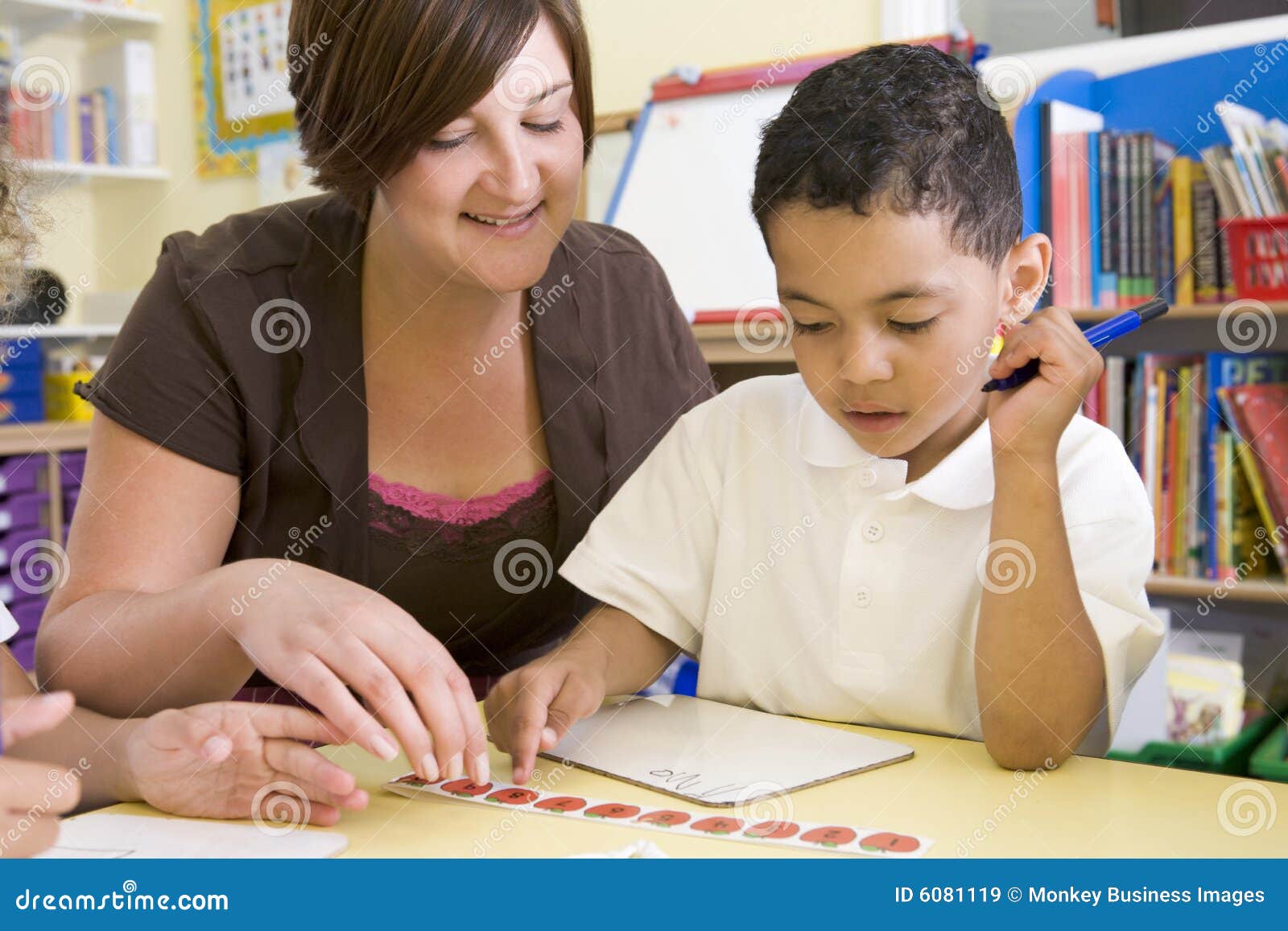 Primary School Teacher Helping Boy Learn Numbers Stock Image - Image of ...