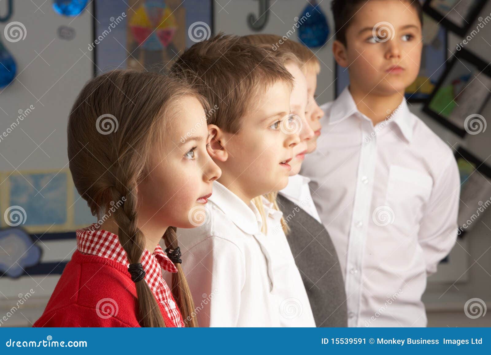 Primary Schoolchildren Standing in Classroom Stock Image - Image of ...