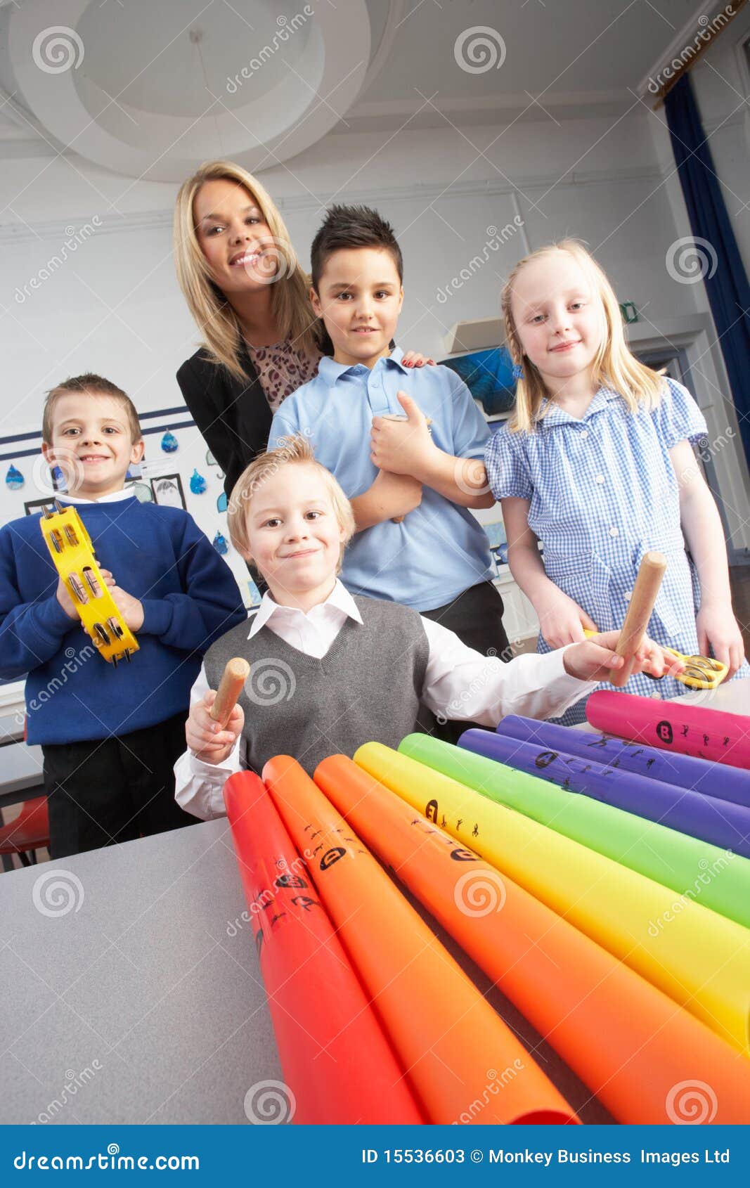 Primary Schoolchildren and Teacher Having a Lesson Stock Image - Image ...