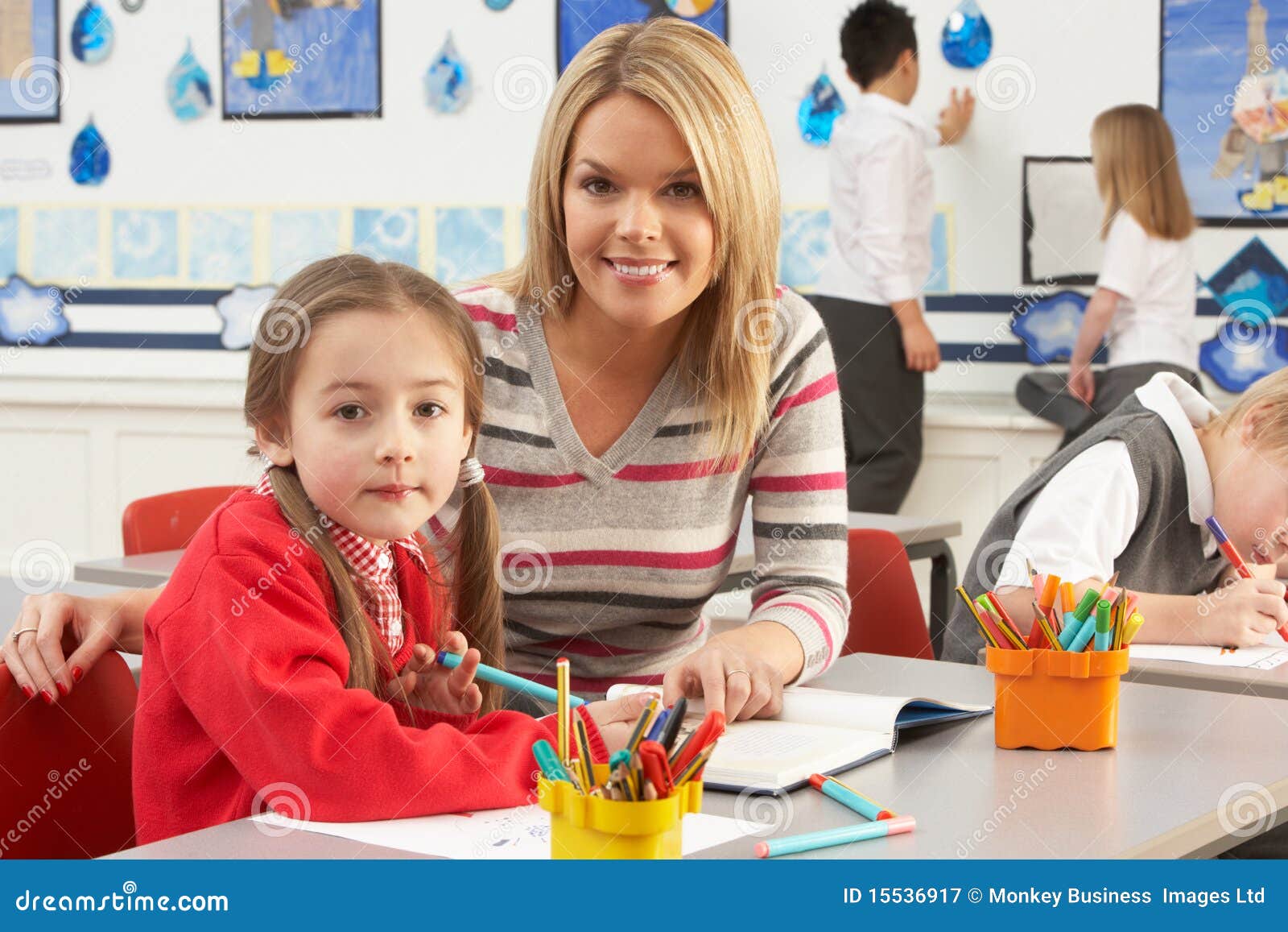 Primary Schoolchildren and Teacher Having a Lesson Stock Image - Image ...