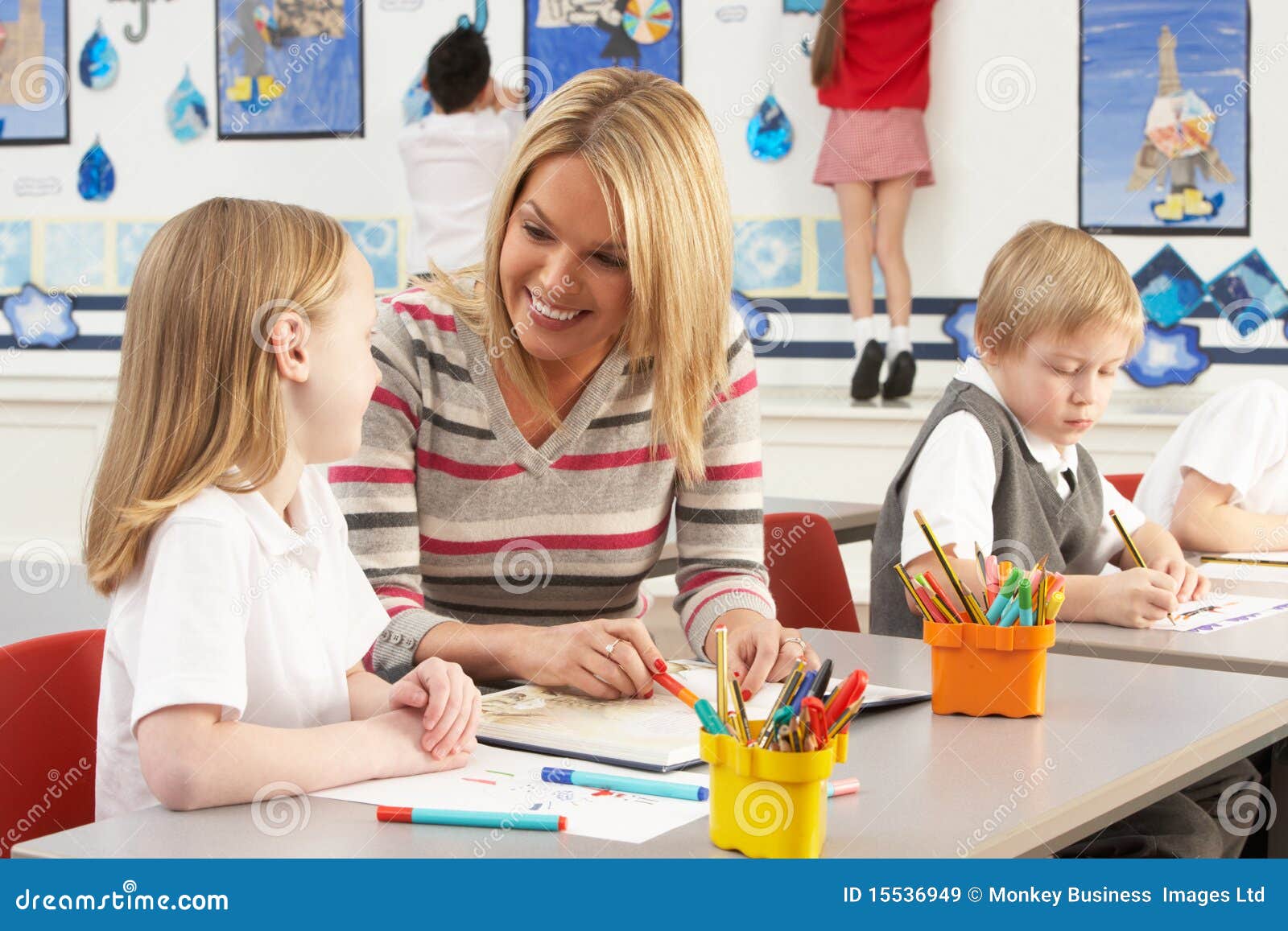 Primary Schoolchildren and Teacher Having a Lesson Stock Image - Image ...