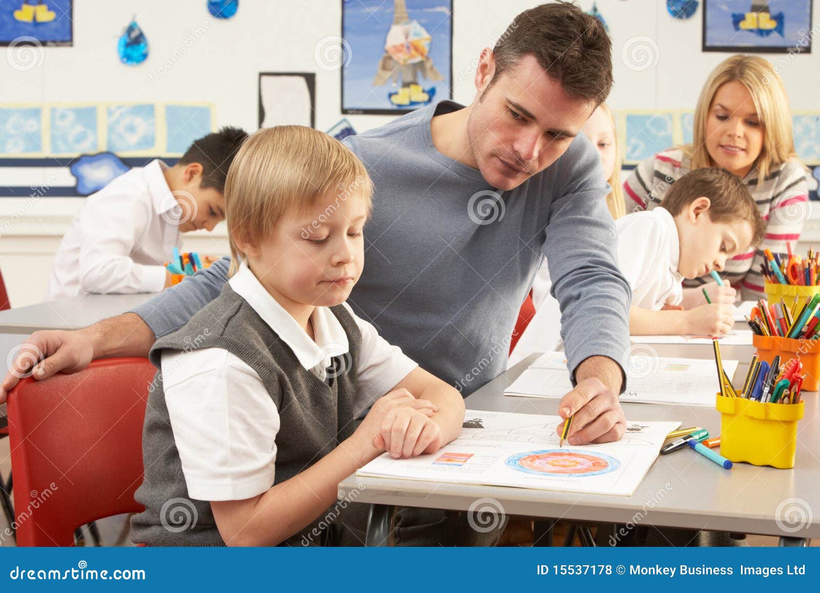 Primary Schoolchildren and Teacher Having a Lesson Stock Photo - Image ...