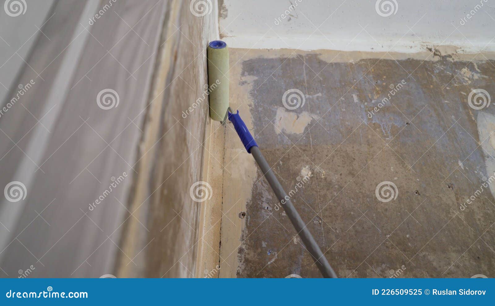 The Process Of Priming A Brick Wall. A Primer Solution Is Applied To A ...