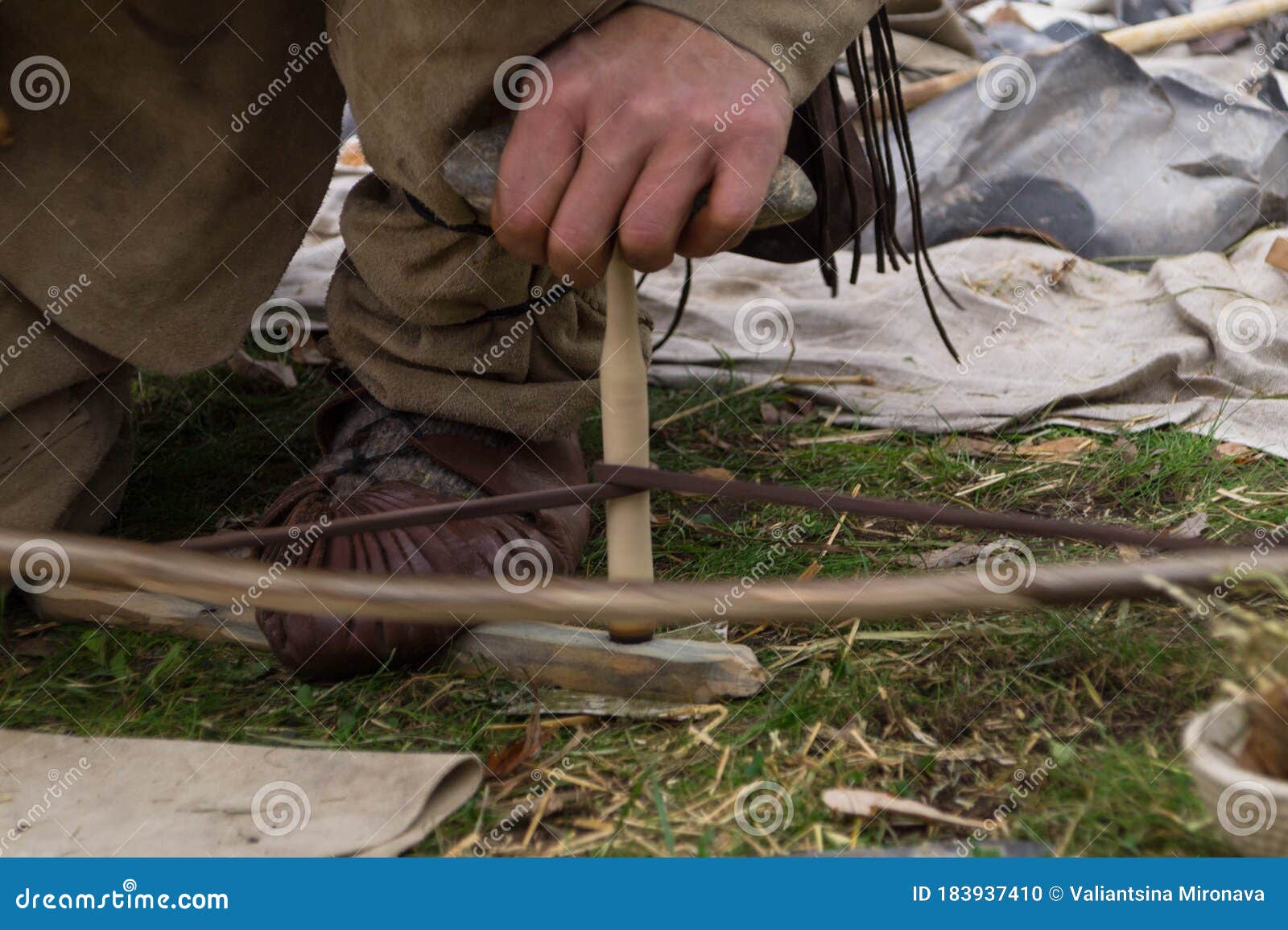 Primitive man makes fire stock photo. Image of primal - 183937410