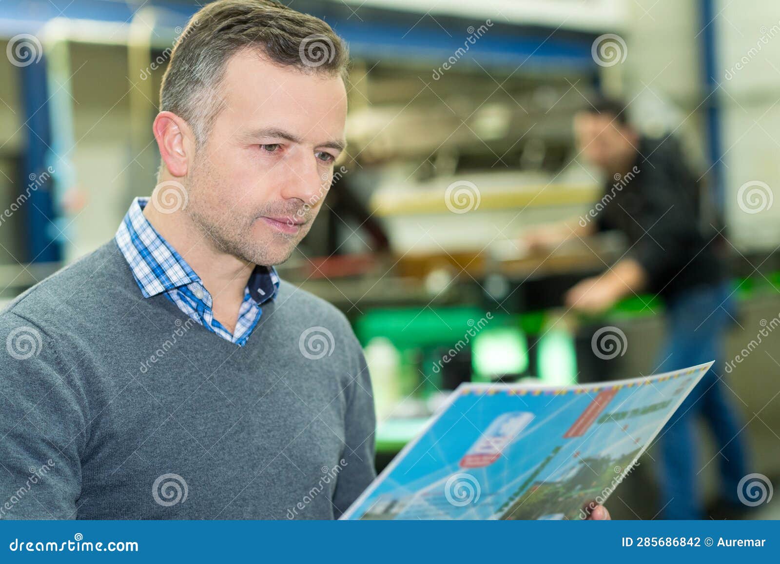 Printer Checking Print Run at Table Stock Photo - Image of cover ...