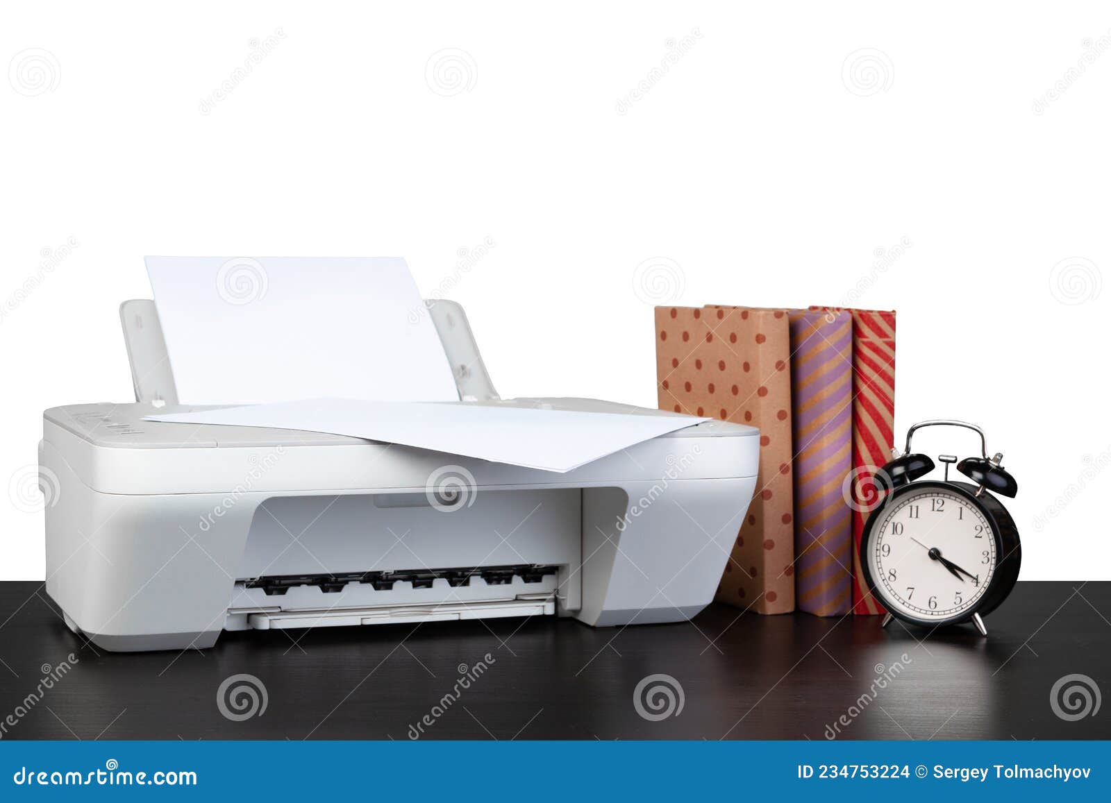 Printer and Stack of Books on Black Table Against White Background ...