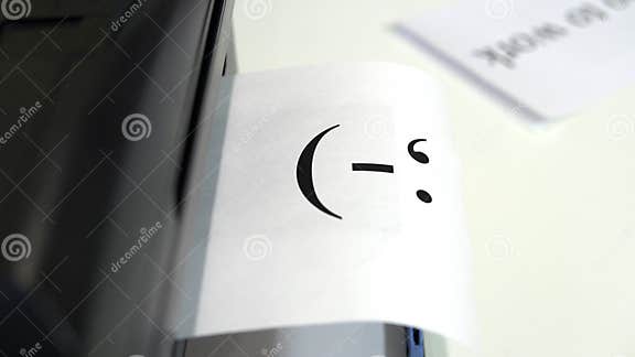 The Printer on the Table Printed a Winking Smiley Face on a Piece of ...