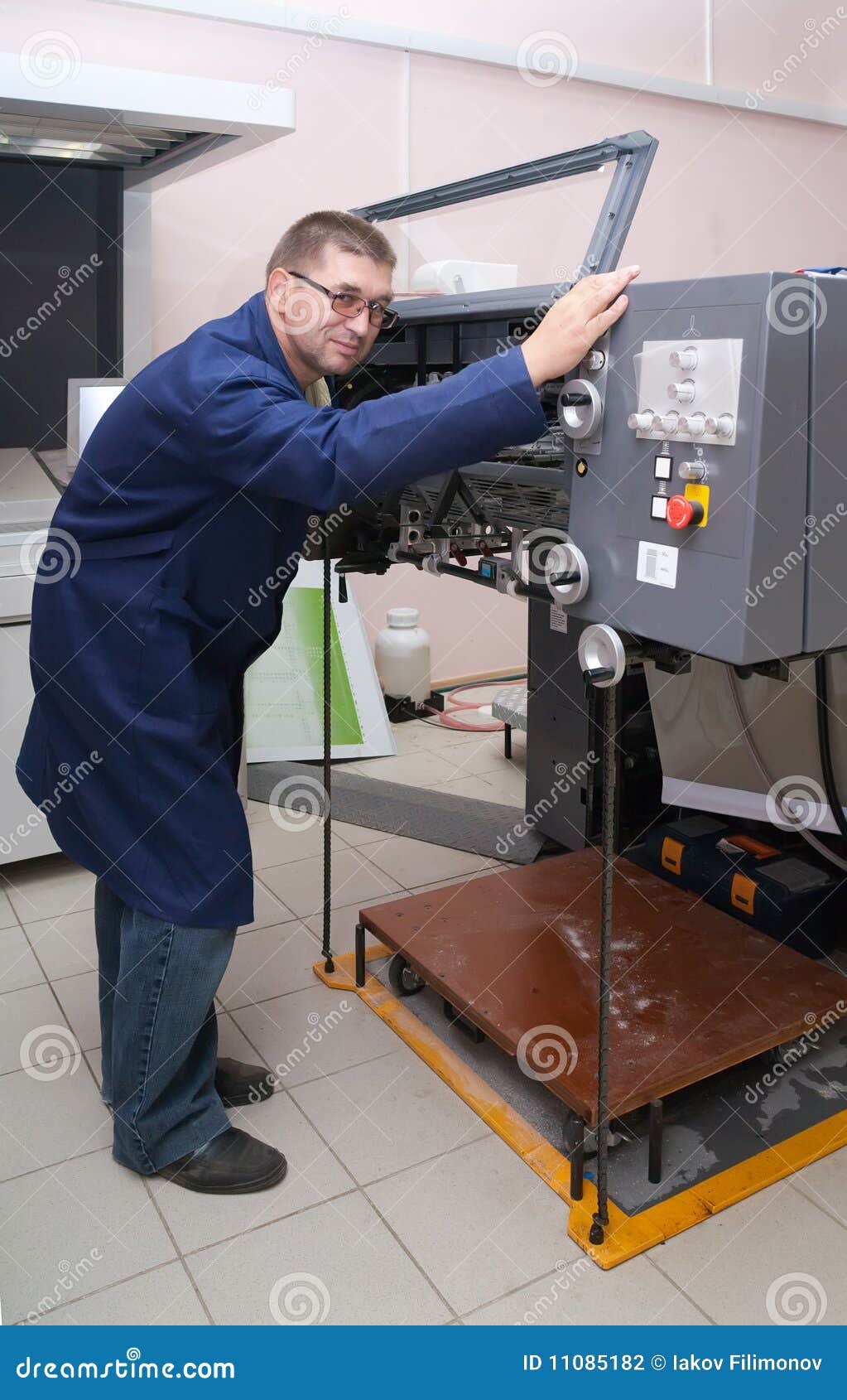 Printer Working at Offset Machine Stock Photo - Image of printer, four ...
