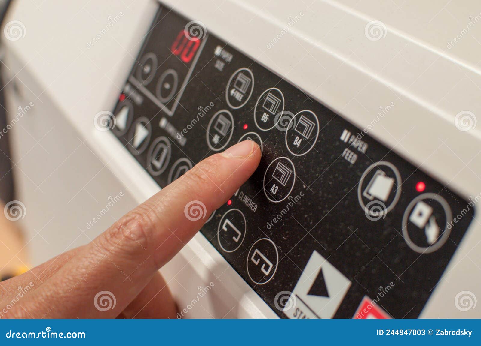 Printing Machine Control Panel with Start Buttons. Worker`s Hand ...