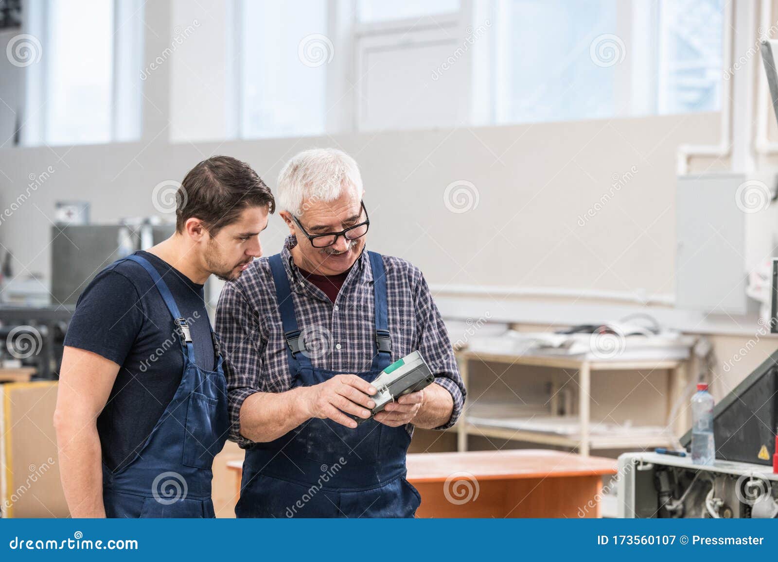 Printing Workers Using Scanning Device Stock Image - Image of holding ...