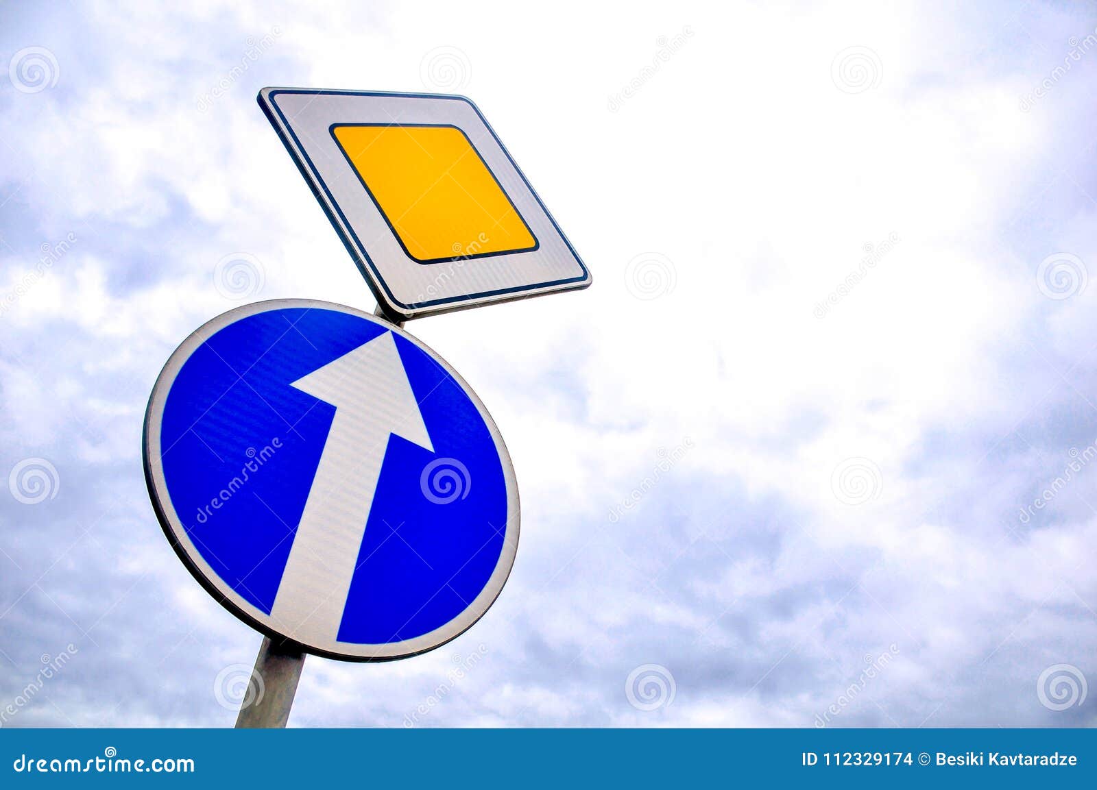 Priority Traffic or Road Sign Stock Photo - Image of cross, cloudy ...