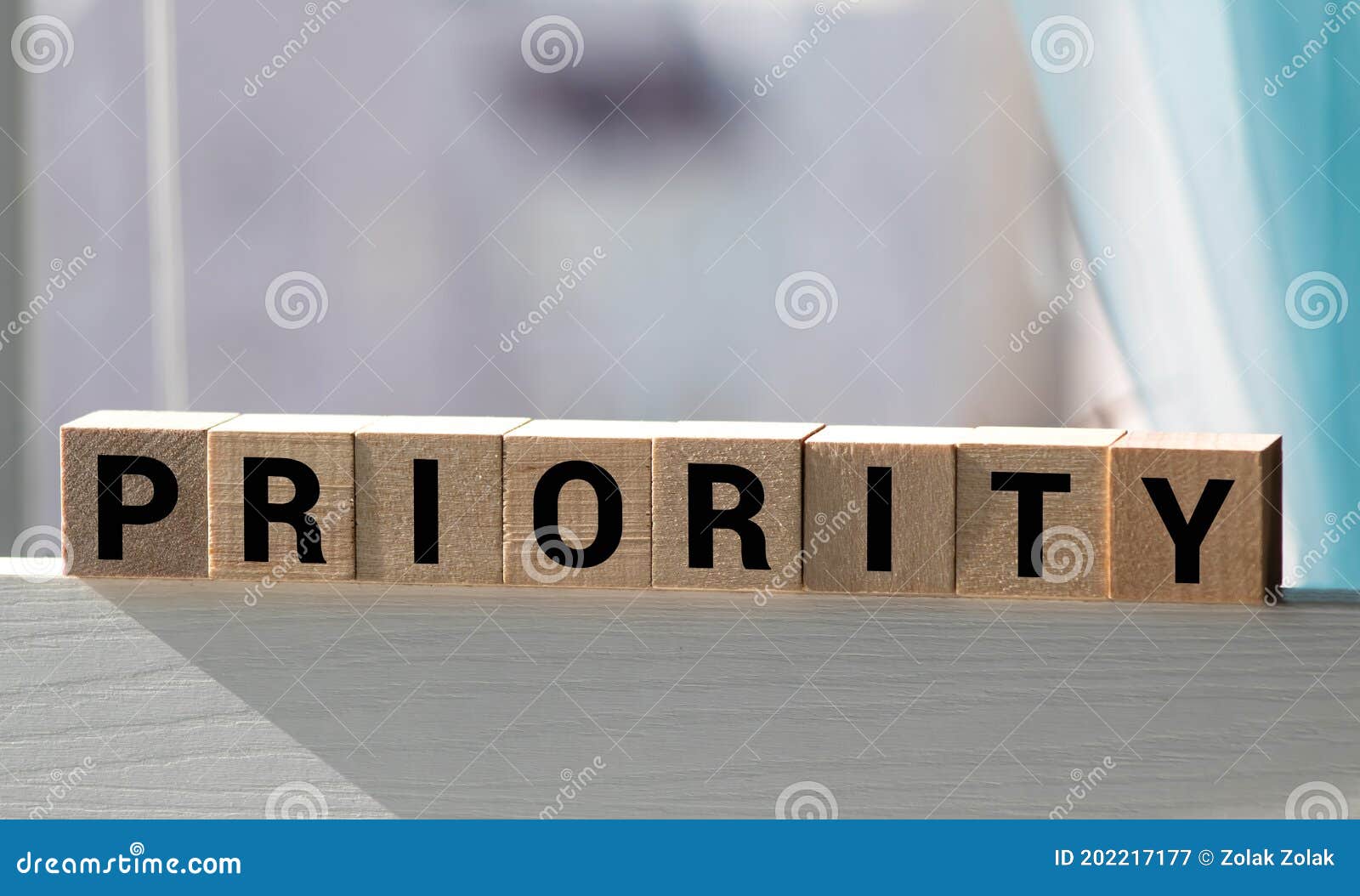 Priority Word Written on Wood Block. Priority Text on Table, Concept ...