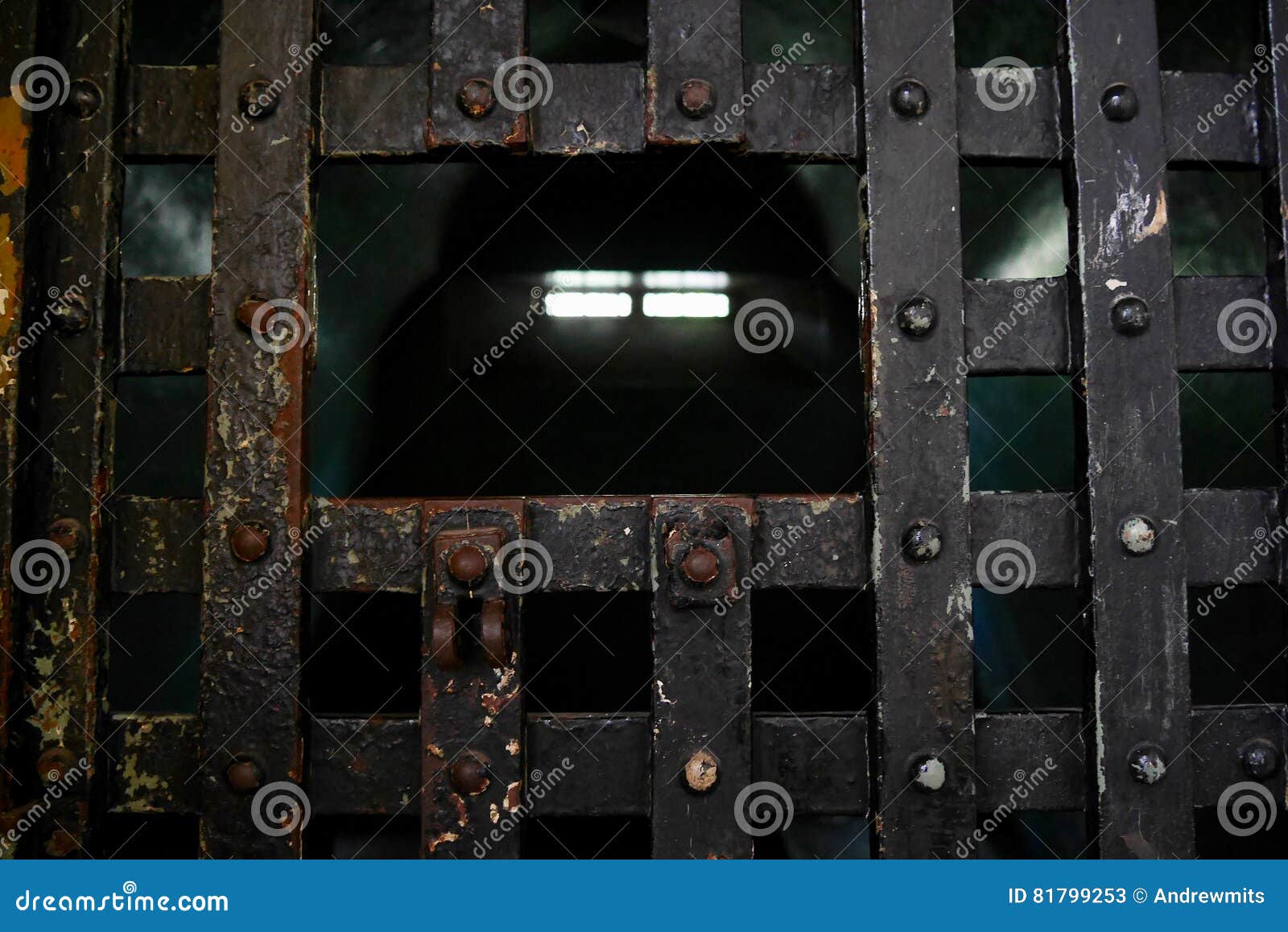 An Old Prison Window With A Stone Wall Grille With A Cross Symbol Of ...