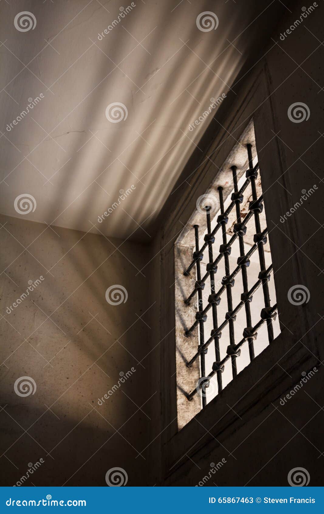 Prison Cell with Light Shining through a Barred Window Stock Image ...