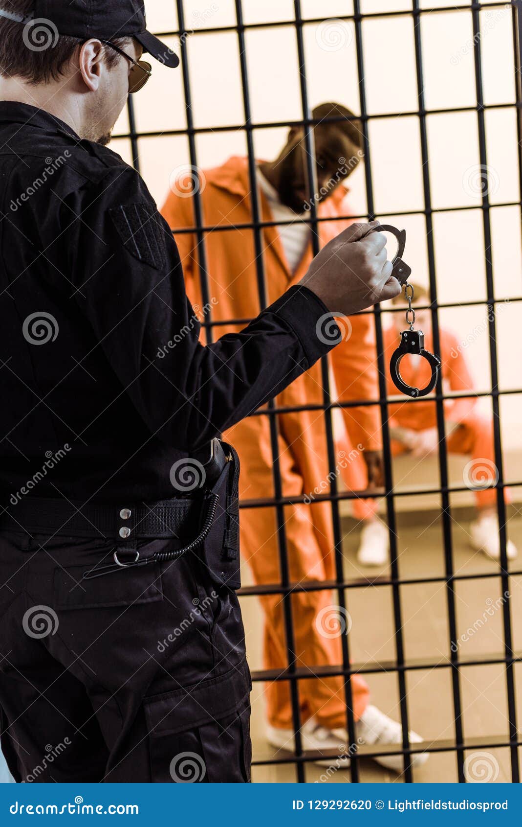 Prison Guard Showing Handcuffs To Stock Photo - Image of prison ...