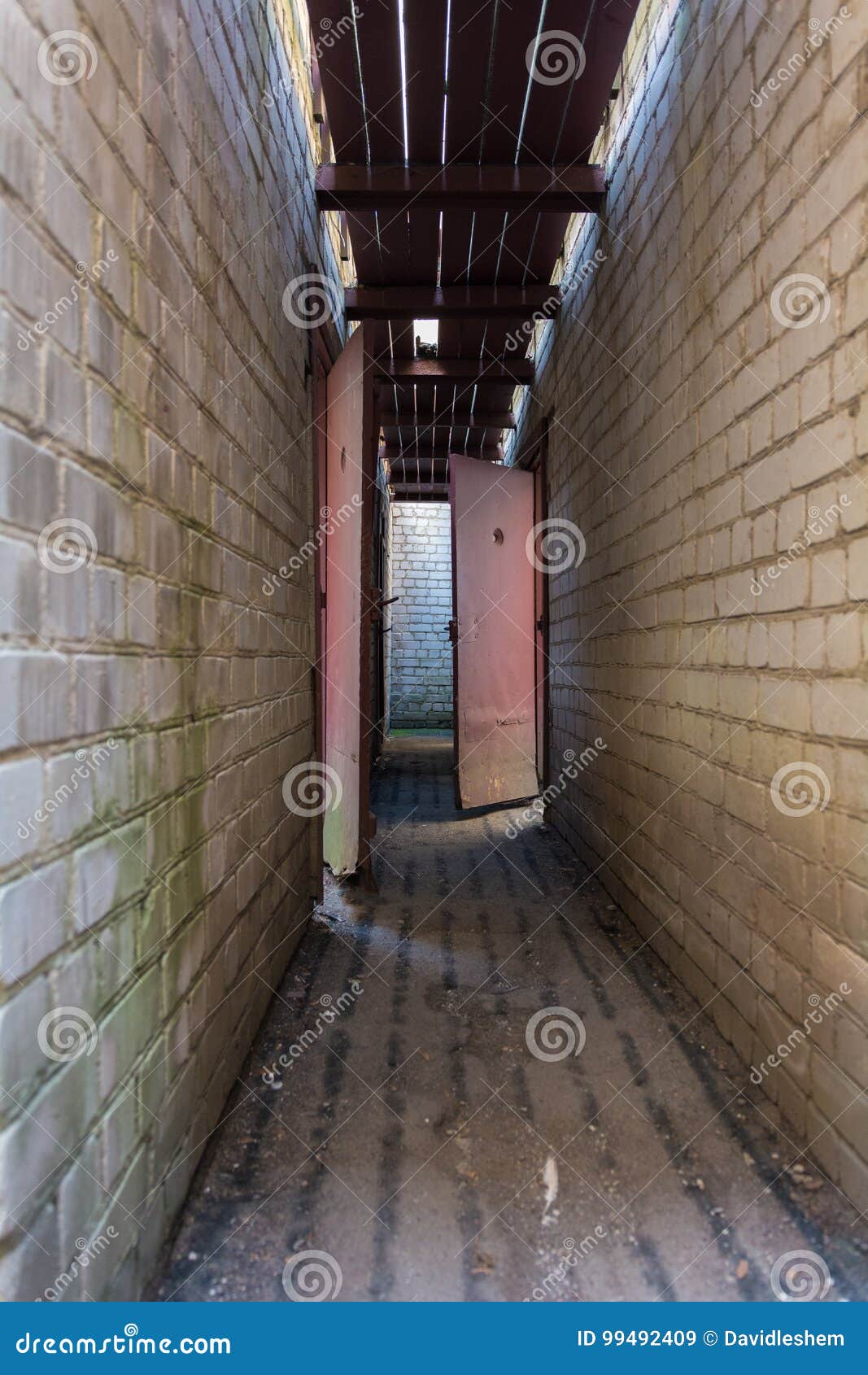 Prison hallway stock image. Image of facility, dark, corridor - 99492409
