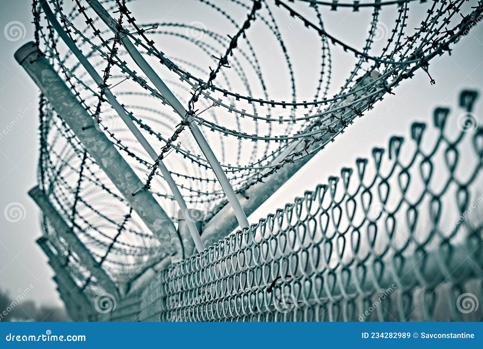Prison fence. Barbed wire. stock image. Image of circles - 234282989
