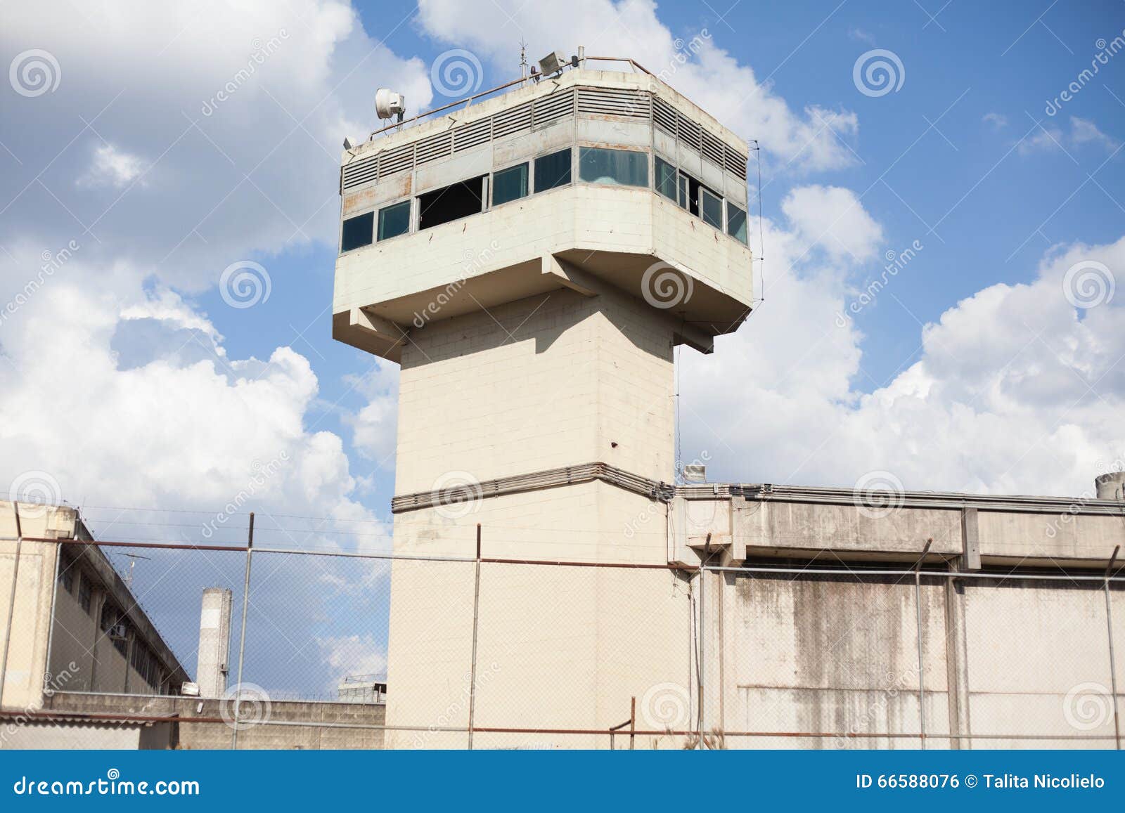 Prison surrounded by gate stock photo. Image of outdoors - 66588076