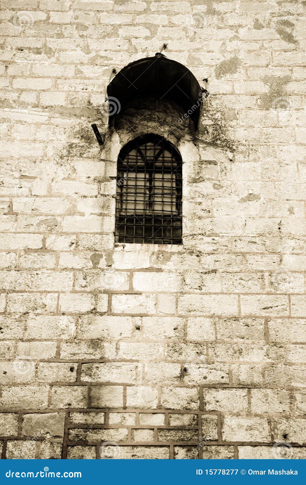 An Old Prison Window With A Stone Wall Grille With A Cross Symbol Of ...