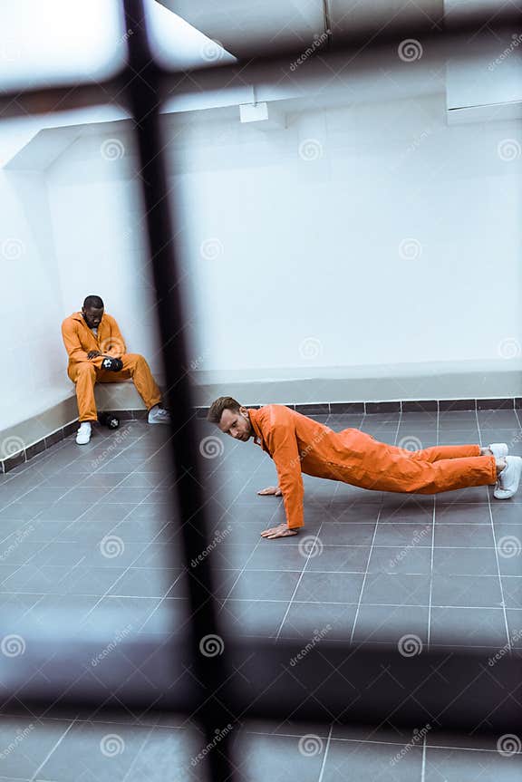 Prisoner doing push-ups stock photo. Image of inmates - 129292702