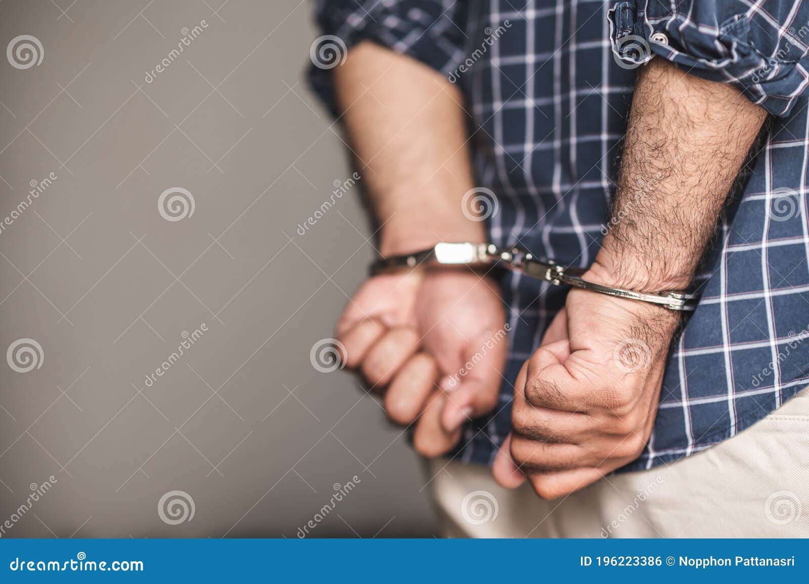 Prisoner Man in Jail with Handcuffs. Close Up Shackled in Hands Stock ...