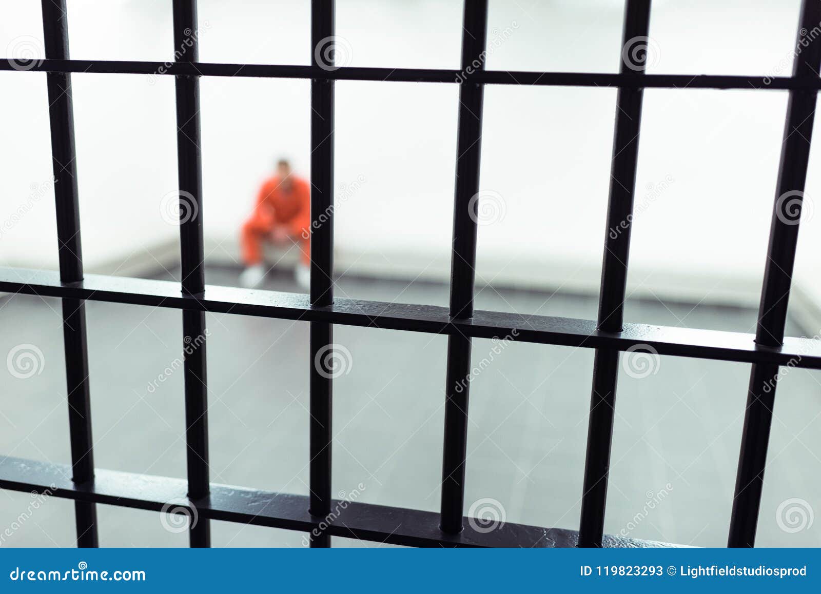 Prisoner Sitting on Bench with Prison Bars Stock Image - Image of ...