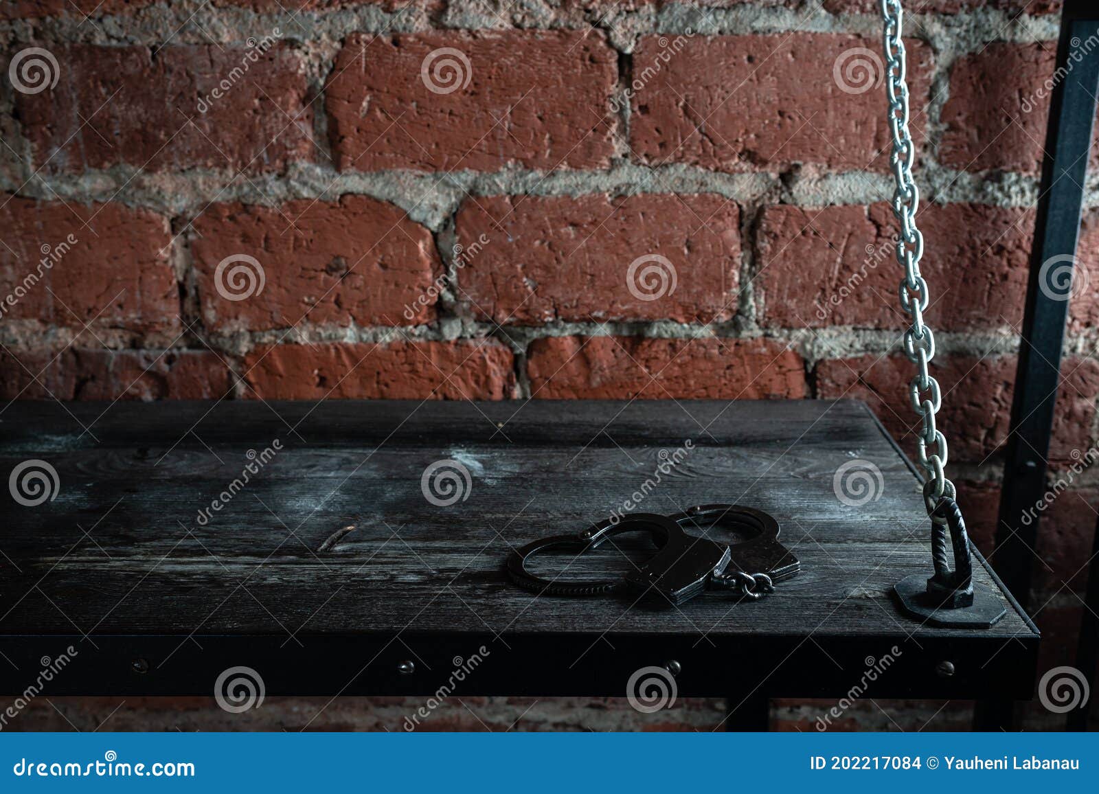 Handcuffs are on the Bench in the Prison Cell Stock Photo - Image of ...
