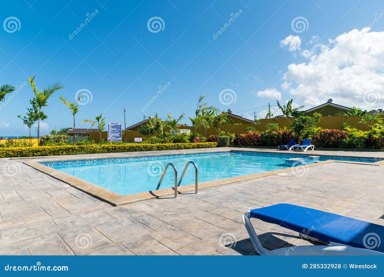 Pristine, Azure Swimming Pool Against the Blue Sky Stock Photo - Image ...