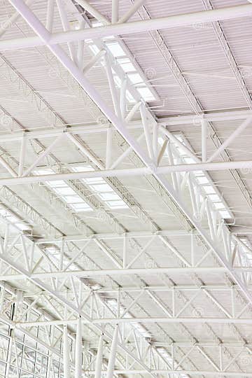 Pristine White Ceiling with All White Metal Support Beams and Window ...