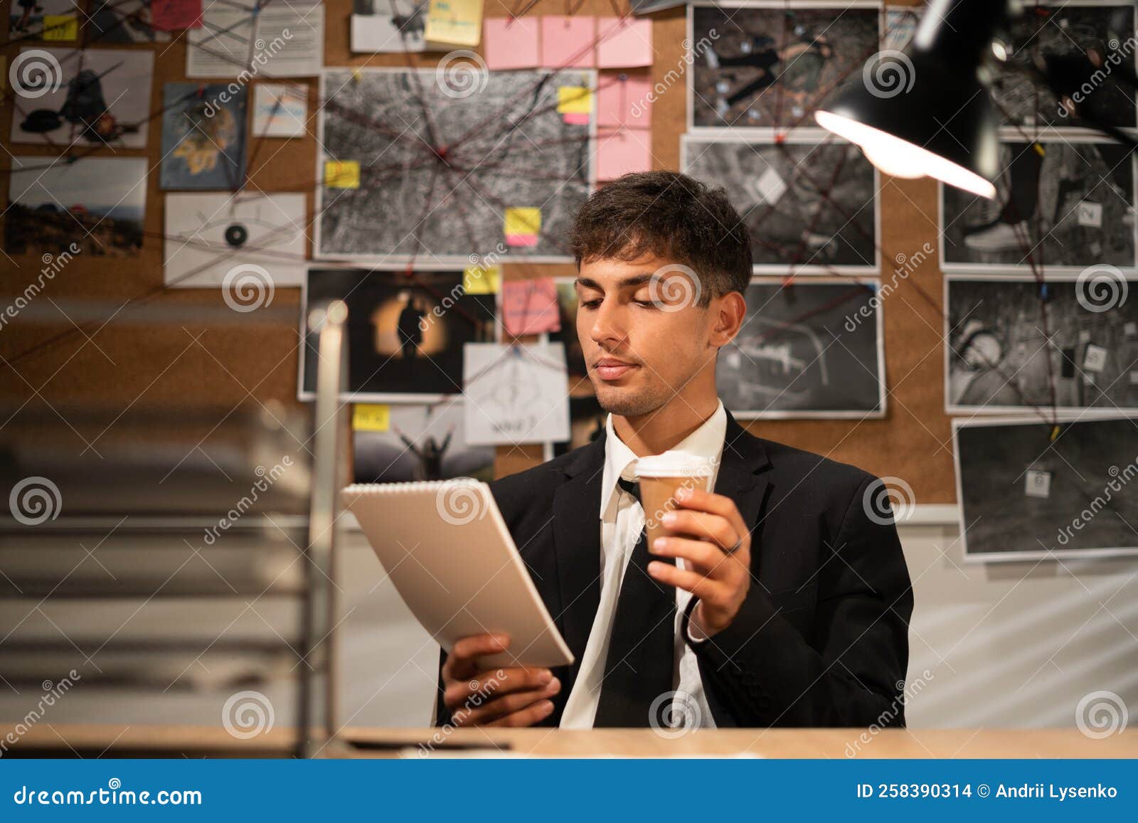 Private Detective Working at Desk in His Office, Drinking Coffee and ...