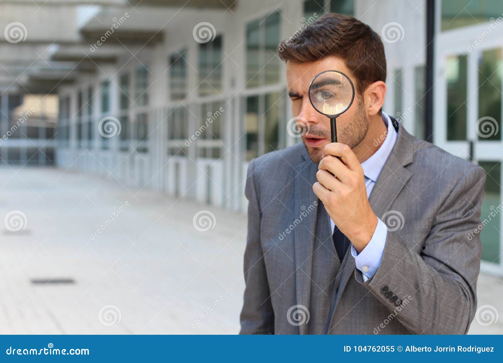 Private Investigator Looking through a Magnifying Glass Stock Image ...