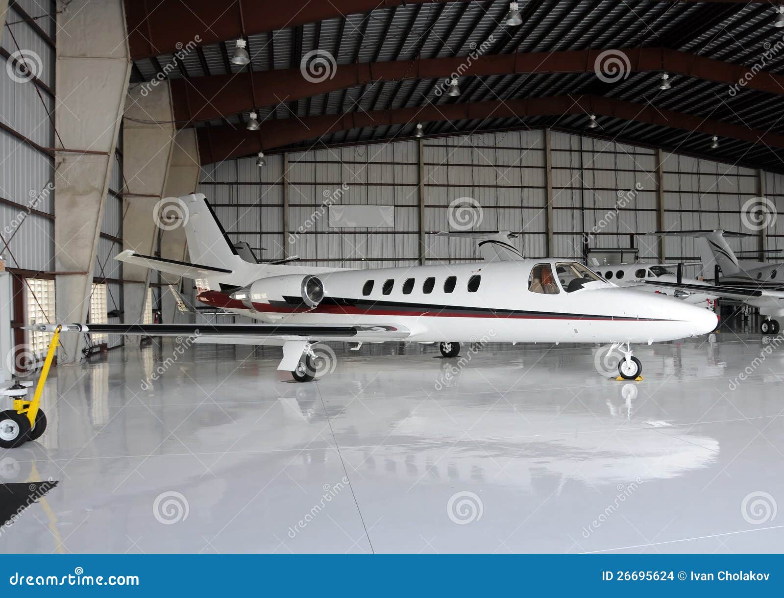 Private jet in hangar stock photo. Image of aircraft - 26695624