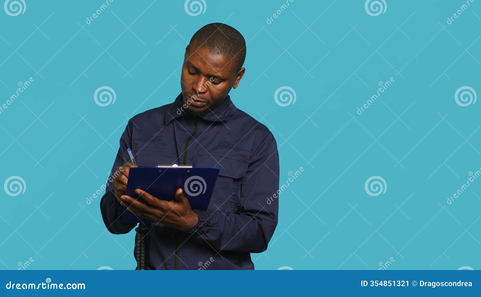 Private Law Enforcement Worker Using Pen To Write Down Orders Received ...