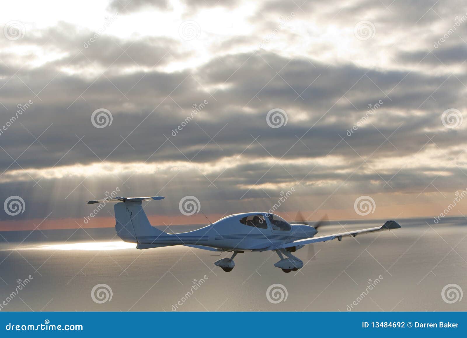 Private Plane Flying Over Sea at Sunset Stock Photo - Image of small ...