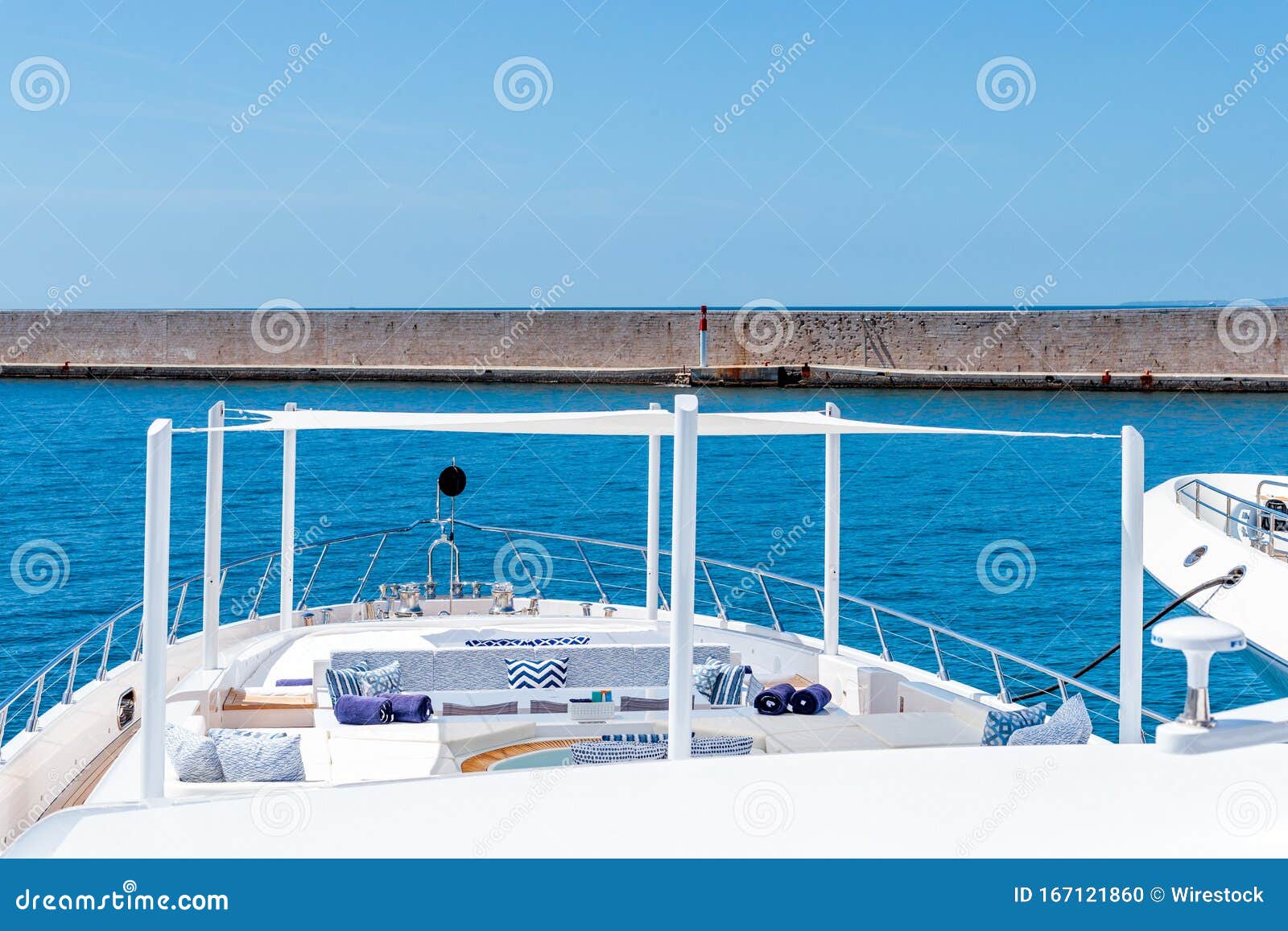 Private Yacht Sailing in the Ocean with a Pool and Sofas on the Board ...